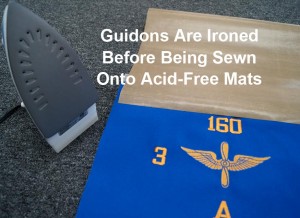 Guidons Are Ironed Before Being Sewn Onto Acid-Free Mats - Framed Guidons*