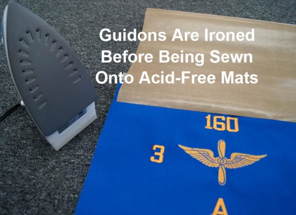 Guidons Are Ironed Before Being Sewn Onto Acid-Free Mats - Framed Guidons*